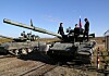 With female touch, tank drivers show off finesse near border to Norway